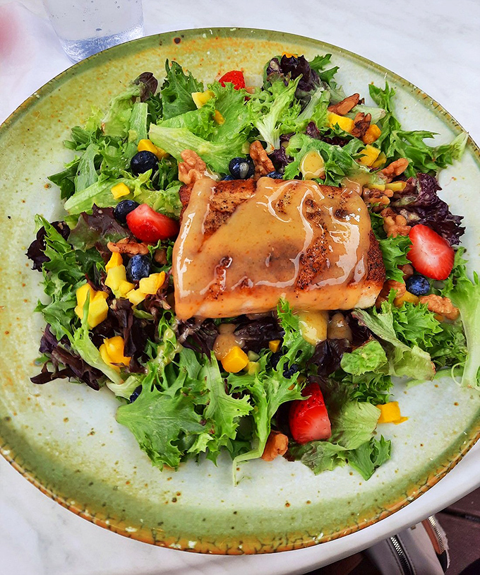 The honey glaze catches the light as it drips over perfectly cooked fish &ndash; a dish that tastes as spectacular as it looks.