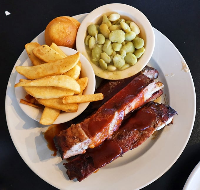 Saucy, tender ribs flanked by lima beans and fries &ndash; proof that happiness can indeed be served on a single plate.