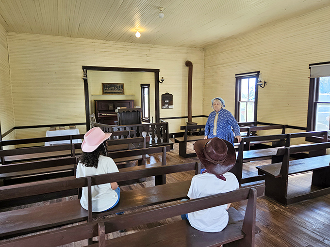 Young visitors experience history firsthand in the one-room schoolhouse, where lessons come alive without a single PowerPoint presentation.