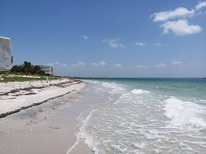 Where turquoise meets ivory: The gentle rhythm of waves creates nature's most soothing soundtrack along Gasparilla's untouched shoreline.