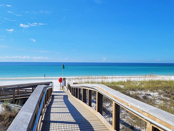 That water is impossibly blue! Following this perfect boardwalk path down to the dazzling, white-sand coastline