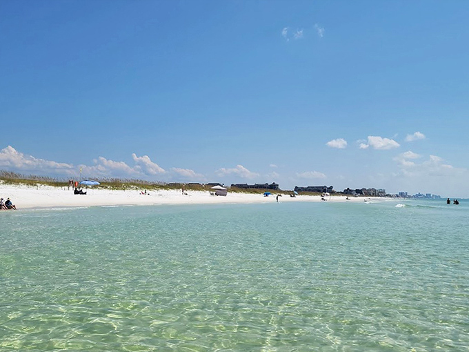 That water is like glass! Enjoying the spectacular, crystal-clear emerald waves and the wide, powdery white beach.