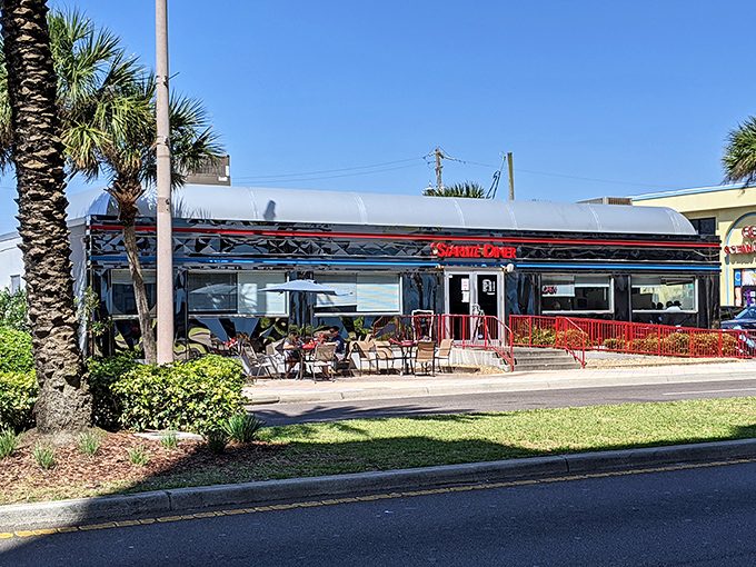 The classic stainless steel diner car of Starlite shines in the Florida sun, promising air-conditioned comfort and pancakes the size of hubcaps.