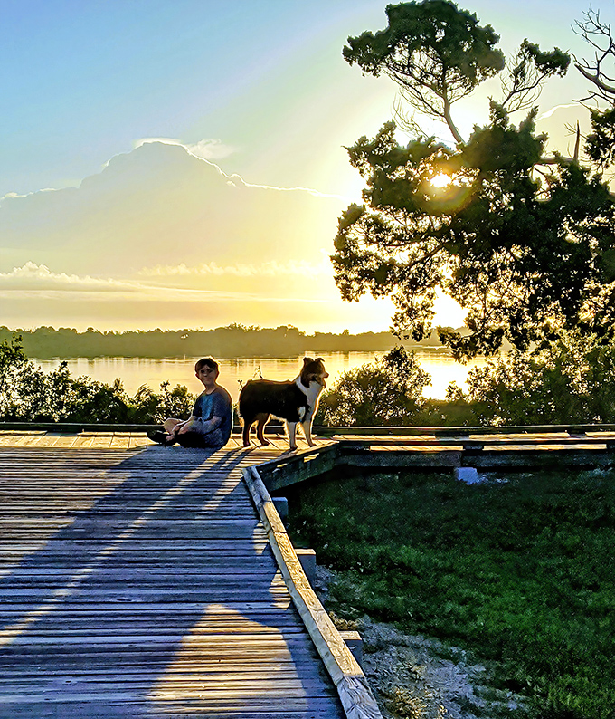 Sunset brings golden moments to Seminole Rest, where visitors and four-legged friends pause to appreciate nature's daily masterpiece.