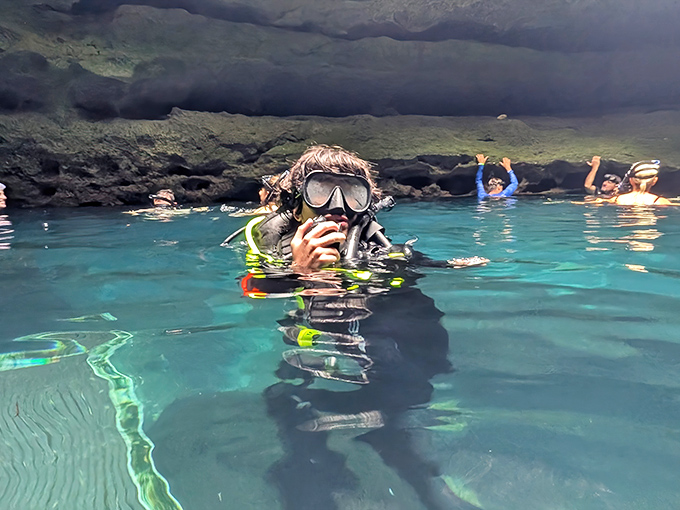 Divers explore crystal waters that have remained unchanged for millennia, like time travelers swimming through Earth's geological scrapbook.
