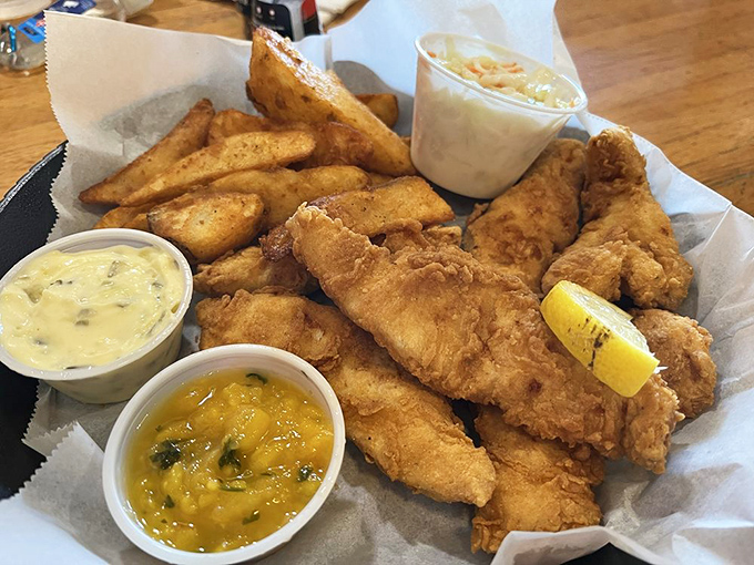 Beer-battered fish so fresh it practically jumps onto your plate, accompanied by potato wedges that redefine "crispy on the outside, fluffy inside."