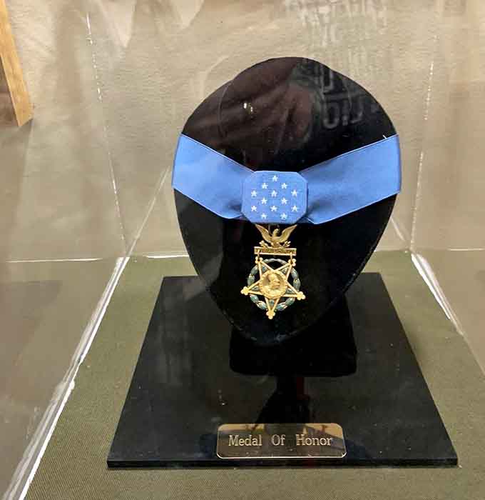 The Medal of Honor display commands reverence, representing acts of valor so extraordinary they defy ordinary comprehension.