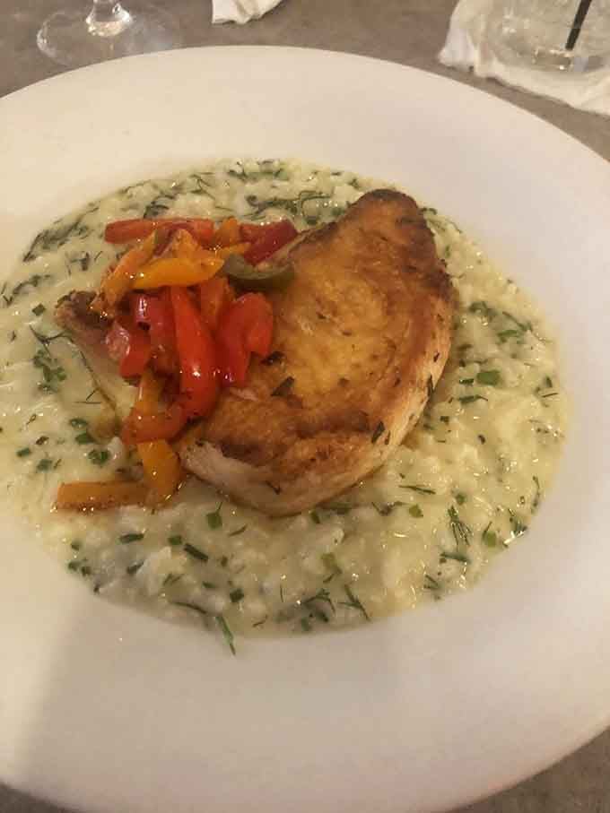 Chicken and risotto come together in a dish that's both homey and sophisticated, like Sunday dinner went to finishing school.