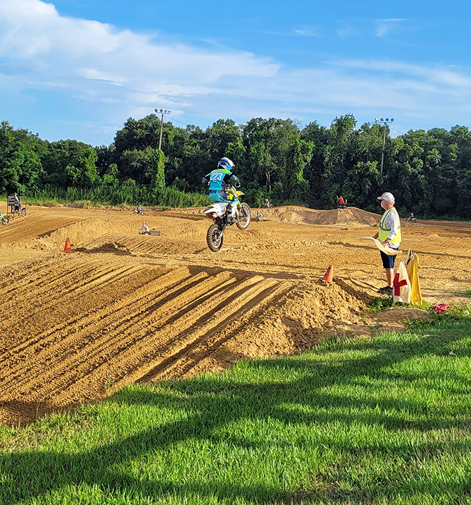 Dade City Raceway kicks up dust and adrenaline as motocross riders catch air on the carefully groomed dirt track.