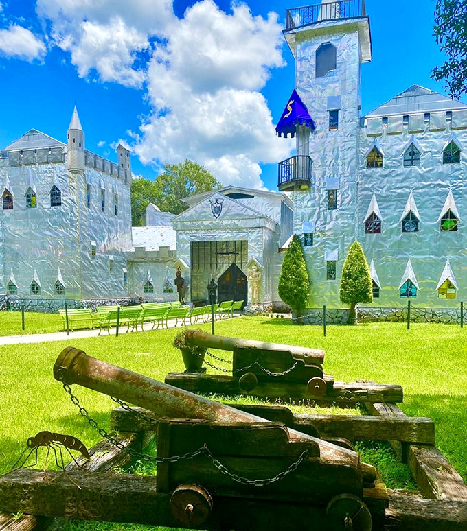 The castle's main entrance beckons with the promise of wonders within, flanked by sculptures that hint at the creative explosion waiting inside.