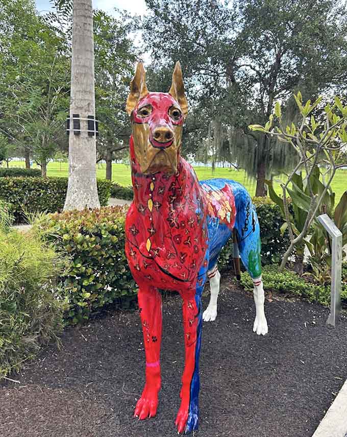 This Doberman's paint job suggests it moonlights as a superhero, which honestly tracks for the breed's protective nature.