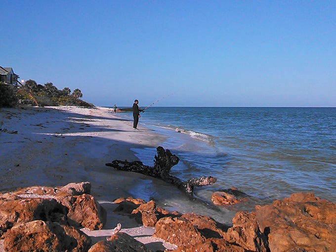 Anglers cast lines into the gentle surf, practicing the island's favorite form of meditation where patience is rewarded with dinner.