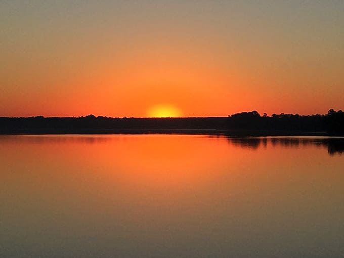 Sunsets over Rocky Bayou paint the sky in colors that make professional photographers weep with joy and amateurs weep with frustration.