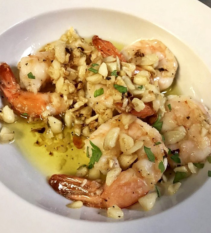 Garlic shrimp that demands bread for sopping &ndash; plump crustaceans bathed in fragrant olive oil, minced garlic, and fresh herbs.