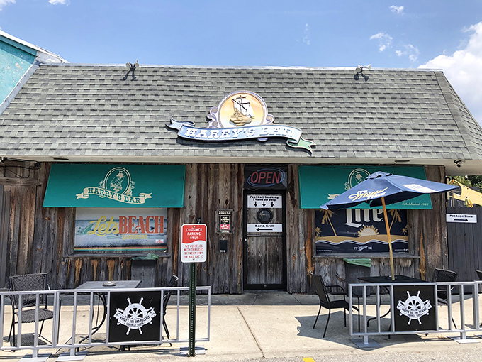 Harry's Bar wears its weathered wooden exterior like a badge of honor – inside, cold drinks and warm conversations flow freely.