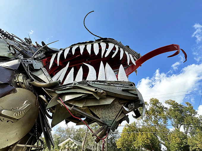 Those jaws! The dragon's head features teeth that appear fashioned from old saw blades, creating a grin that's equal parts terrifying and terrific.