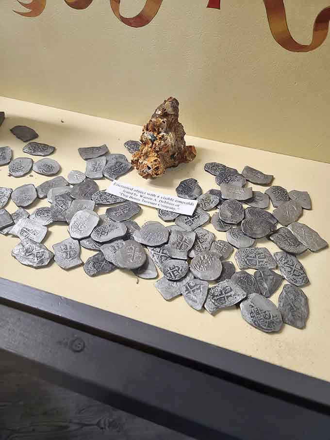 Spanish silver coins scattered like metallic confetti across the ocean floor, each one representing wealth beyond imagination in 1715.