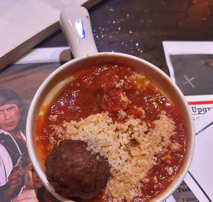 A hearty bowl of tomato-based stew with rice and meatball &ndash; the kind of stick-to-your-ribs fare that fuels epic sword fights.