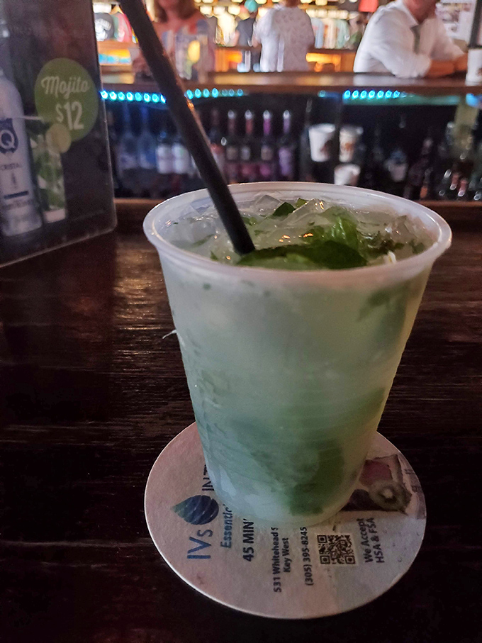 A mojito sits ready for sipping &ndash; mint leaves floating like tiny islands in a sea of refreshment that screams "vacation mode activated."