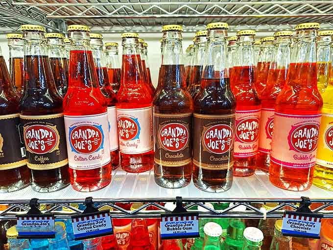 Vintage sodas lined up like colorful soldiers, each bottle containing carbonated nostalgia that tastes exactly like your childhood memories.