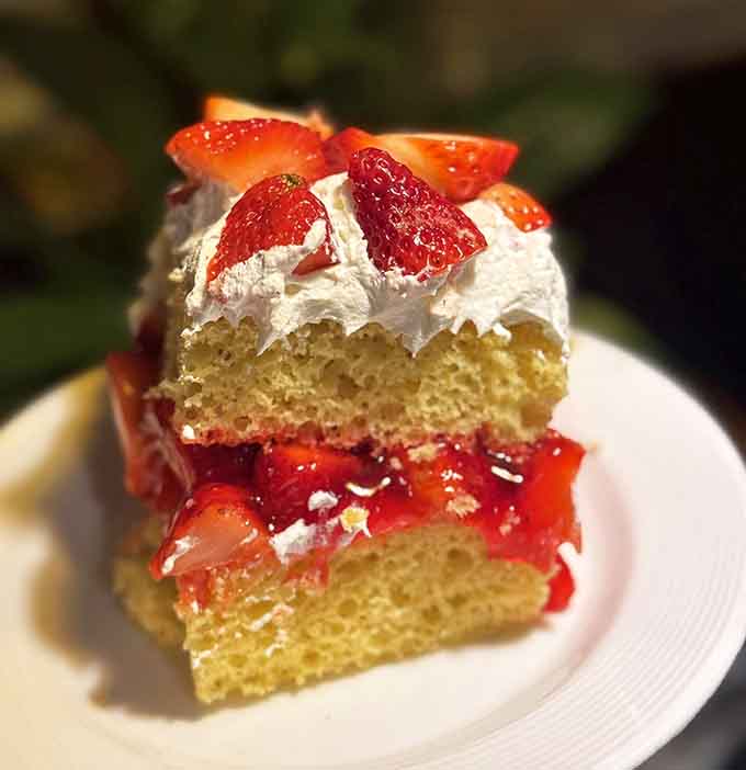 Strawberry shortcake towers with fresh berries and whipped cream, because every great meal deserves a sweet ending.