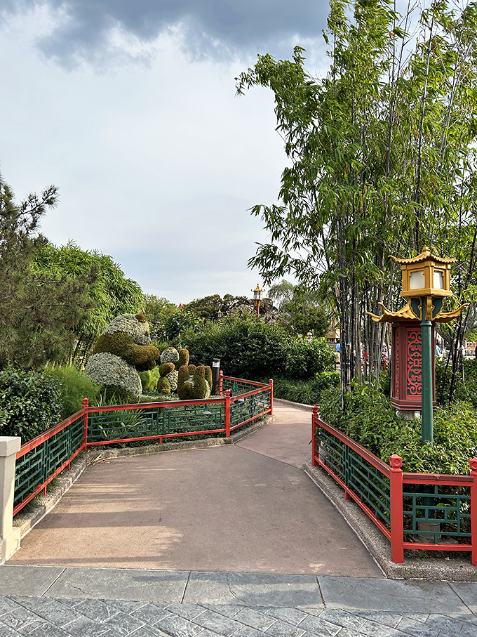 Winding pathways flanked by bamboo invite exploration at a pace that feels wonderfully out of step with typical theme park rushing.