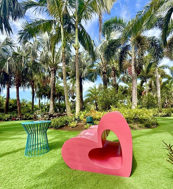 Love takes shape in this bright pink heart bench, offering both a moment of rest and a perfect photo opportunity.