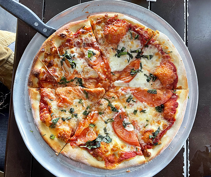 Pizza: A pizza that proves beach towns can do more than seafood &ndash; thin crust, bubbling cheese, and fresh basil that transports you straight to Italy.