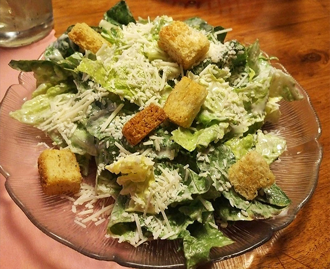 A crisp Caesar salad provides the perfect counterpoint to heartier dishes, with fresh romaine, house-made croutons, and a shower of Parmesan.