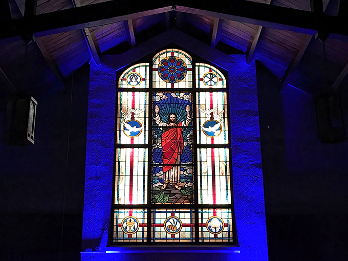 Breathtaking artistry! This magnificent stained glass window illuminates the sanctuary with vibrant colors and spiritual imagery.