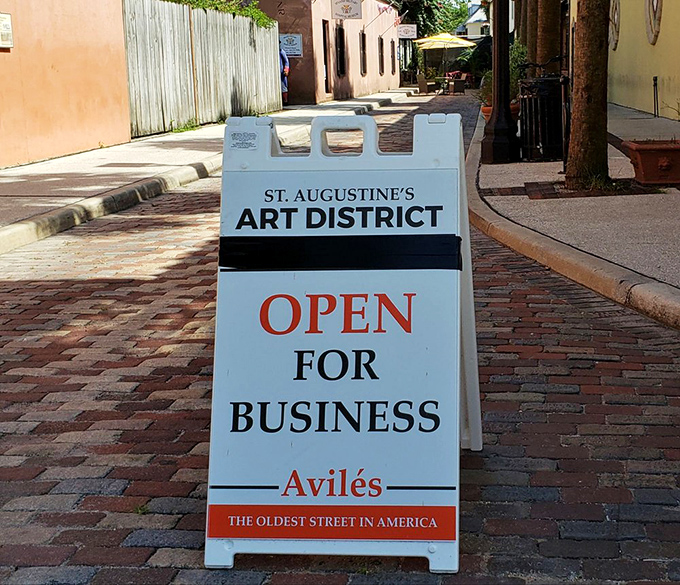 Balconies bursting with flowers and flags create vertical gardens that soften the colonial architecture with splashes of color and life.
