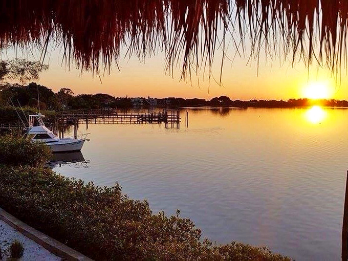 Golden hour transforms the harbor into a painter's palette, where boats rest on mirror-like waters reflecting the day's final masterpiece.