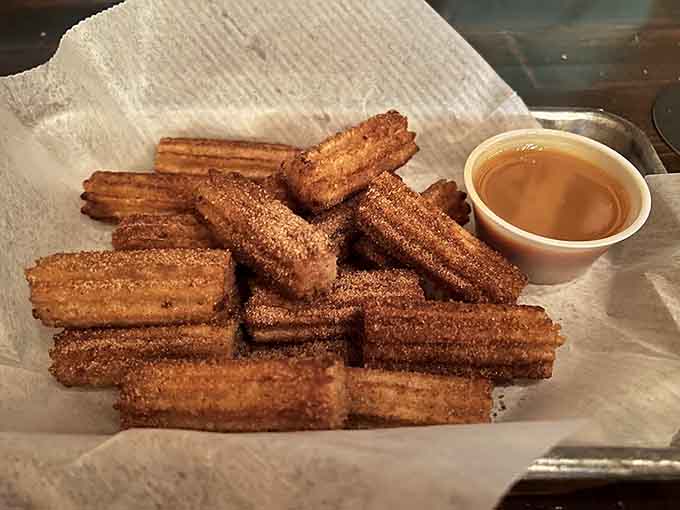 Churros dusted with cinnamon sugar and served with dipping sauce, because Taco Dive believes every meal deserves a sweet ending.