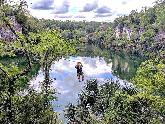Pure joy captured mid-flight, proving that sometimes the best therapy involves a harness, a cable, and absolutely spectacular views below.
