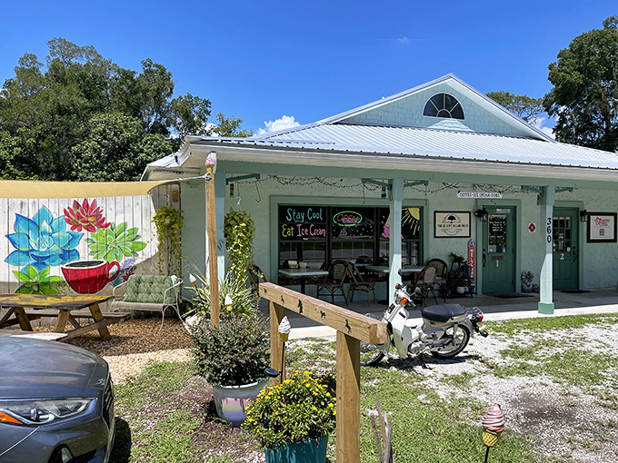 The Lil Cafe's cheerful mint-green exterior and outdoor seating area prove that sometimes the smallest establishments serve up the biggest charm.