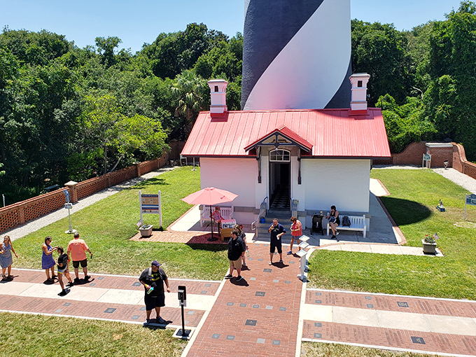 Visitors: Tourists gather at the base of this maritime marvel, unaware they might be posing for photos with both the living and the spectral.
