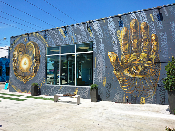 Warby Parker's Wynwood location features this mesmerizing golden artwork that somehow makes buying glasses feel like a spiritual experience.