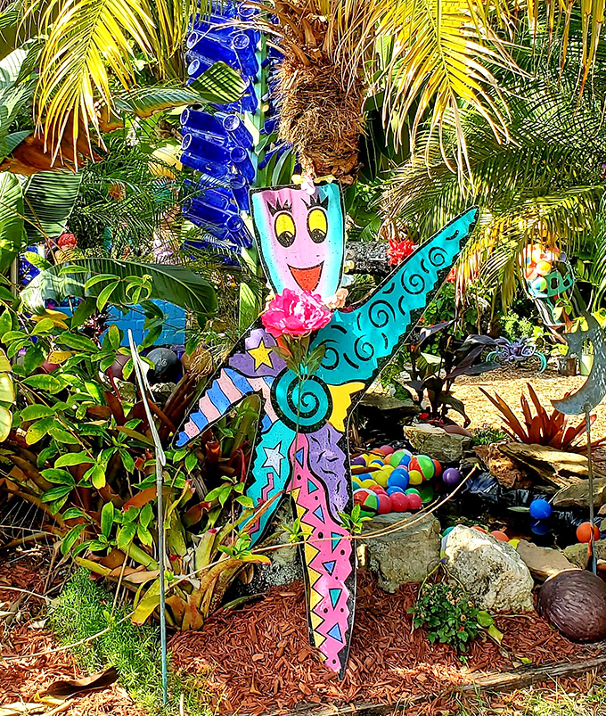 A cheerful fairy-like figure brings cartoon joy to the garden &ndash; as if a children's book illustrator decided reality needed more color.
