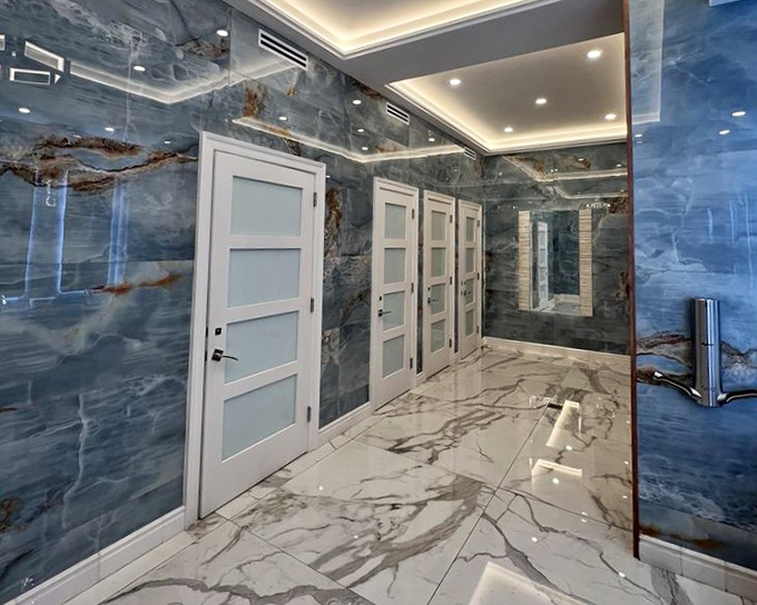 Blue marble bathroom walls that make you feel like you're showering inside an aquarium, minus the judgmental fish watching you lather up.