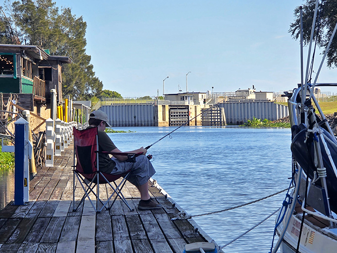 Patience personified: A peaceful moment on the dock where time slows down and the only urgency is the potential tug on your line.