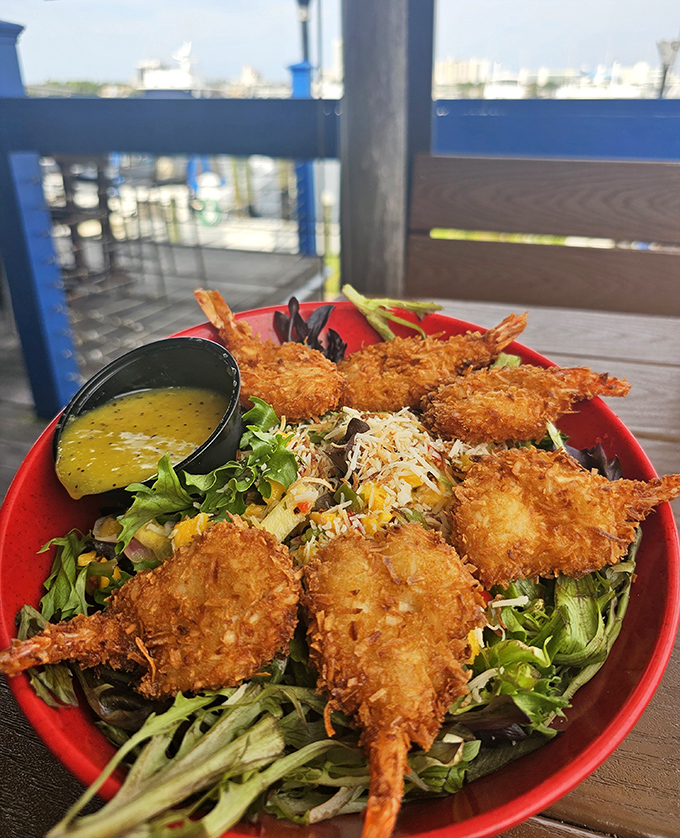 Golden coconut shrimp perched atop fresh greens&mdash;proof that salads can be both virtuous and utterly indulgent at the same time.
