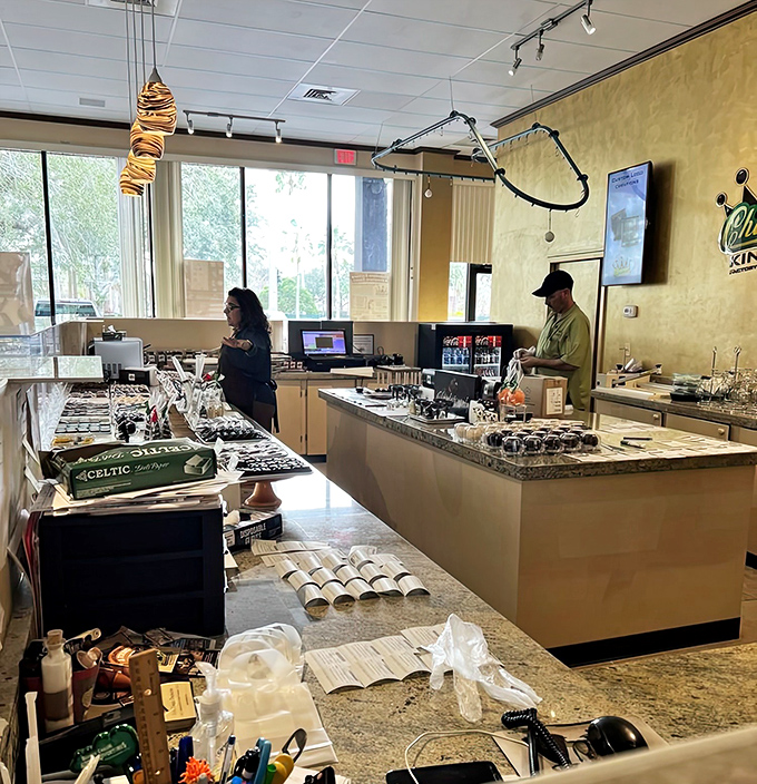 Behind this counter, chocolate magicians transform simple ingredients into complex flavor symphonies while visitors watch with undisguised longing.