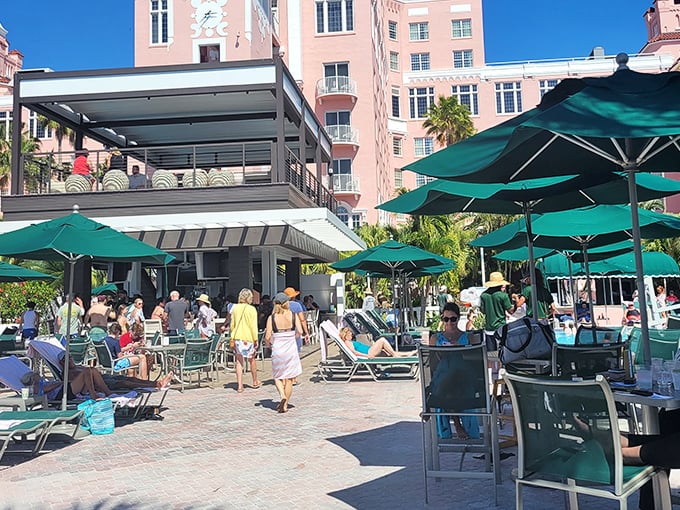 Guests enjoy the perfect Florida afternoon, where umbrellas provide shade and the hardest decision is whether to swim now or later.