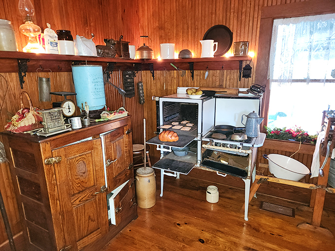 This vintage kitchen would make modern chefs appreciate their conveniences while secretly envying the authenticity of cooking on that wood-burning stove.