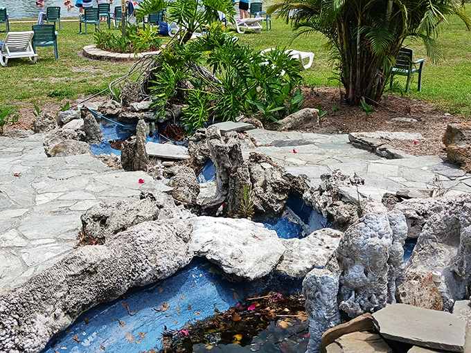 A charming water feature complements the main attraction, offering peaceful bubbling sounds and visual delight.