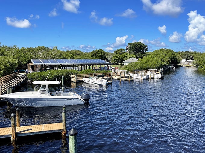 The marina serves as civilization's last outpost, where boats bob gently in anticipation of their next journey to the barrier island paradise.