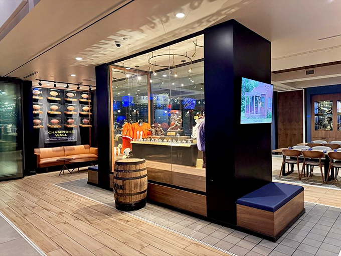 This glass-enclosed shrine to football glory serves as both decor and conversation starter between bites of excellent food.