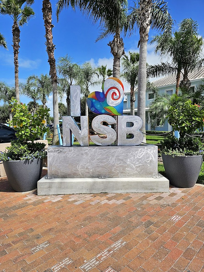 The colorful NSB welcome sign captures the town's artistic spirit and beachy vibe, greeting visitors with a splash of coastal creativity.