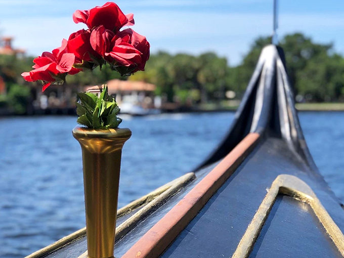 A single red rose adds a touch of romance to the gondola's bow, promising an experience that's anything but ordinary.