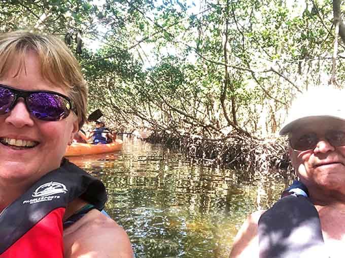 Happy explorers capture memories in the mangrove tunnels, where cell service is spotty but life connection is five bars strong.